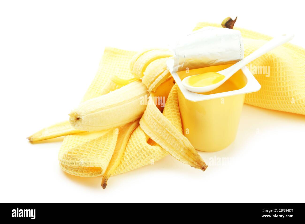 Tasty dessert in open plastic cup and banana, isolated on white Stock ...