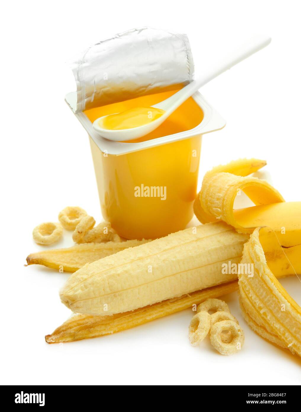 Tasty dessert in open plastic cup and banana, isolated on white Stock ...