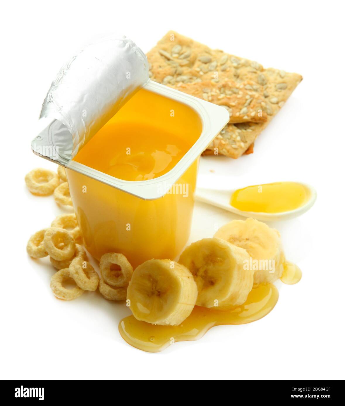 Tasty dessert in open plastic cup and banana, isolated on white Stock ...