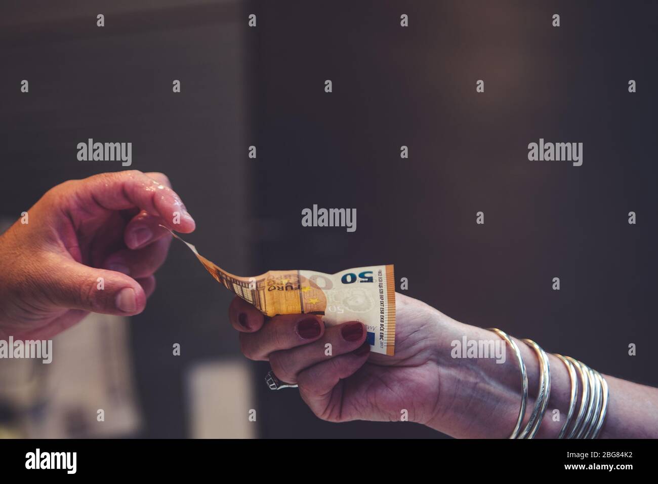 People paying with cash in a Market Stock Photo - Alamy