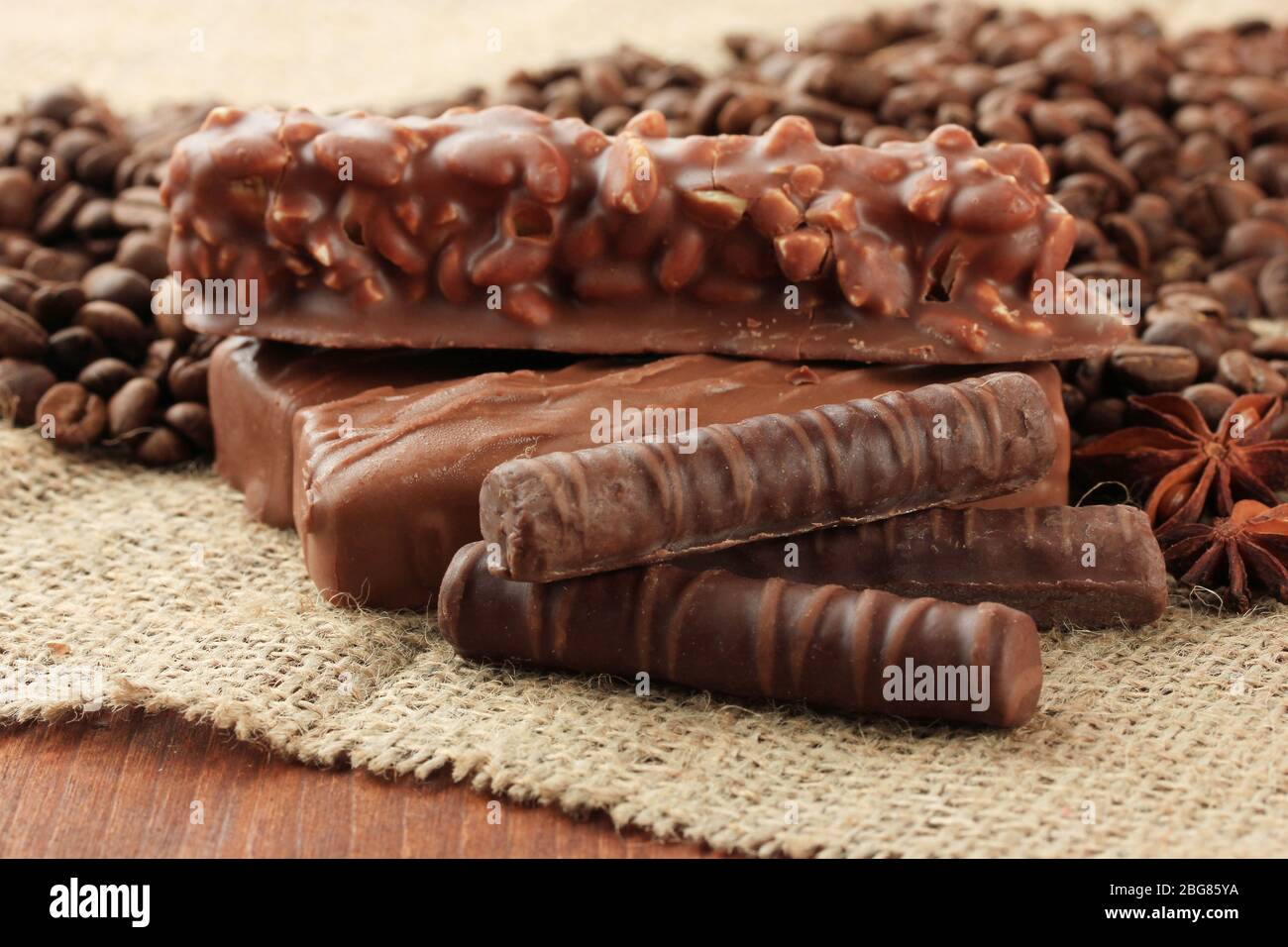 Delicious chocolate bars with coffee beans close up Stock Photo - Alamy