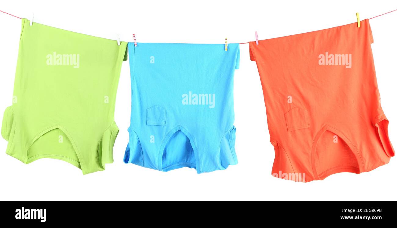 Shirts on rope isolated on white Stock Photo - Alamy