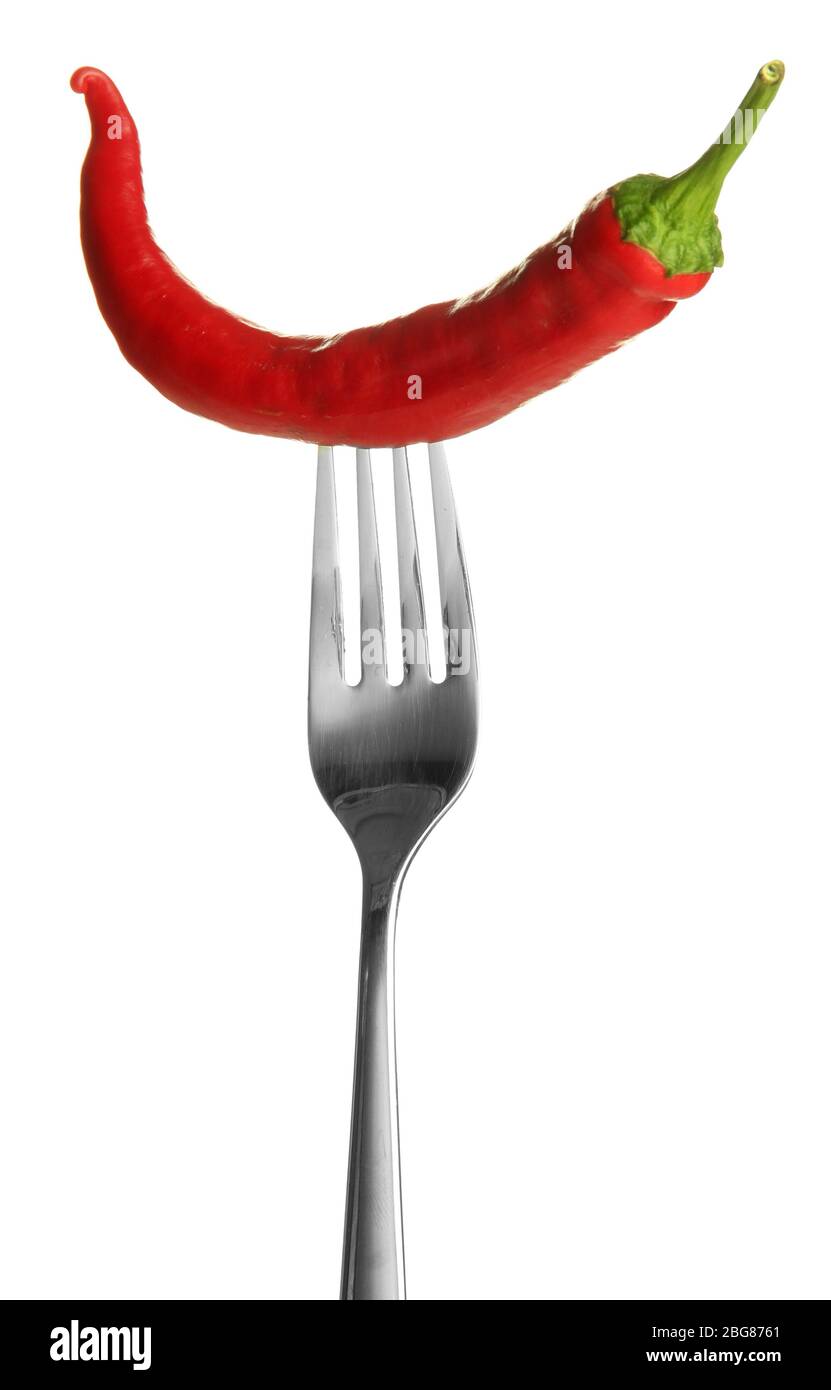 Red hot chili pepper on fork, isolated on white Stock Photo - Alamy