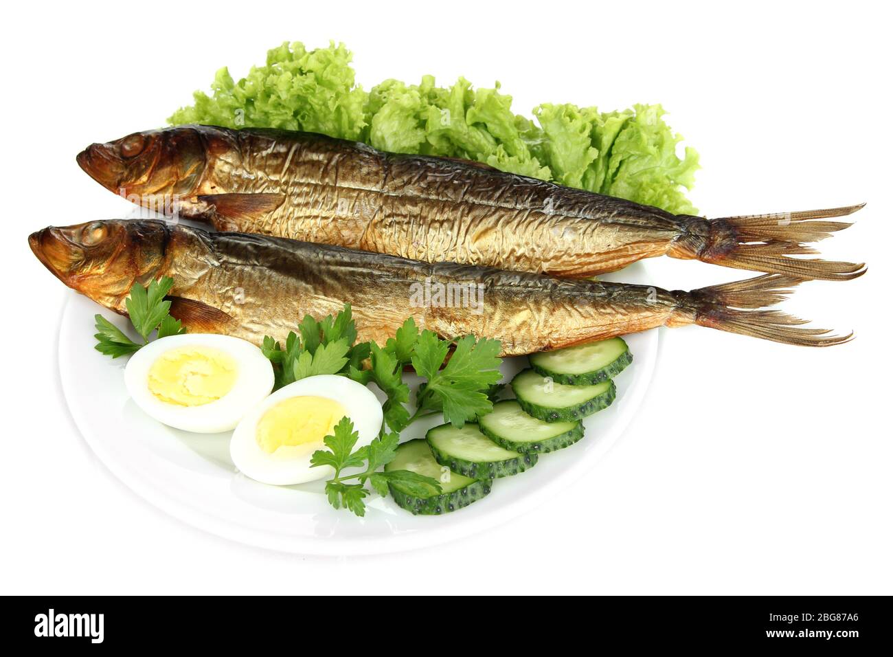 Smoked fish on plate isolated on white Stock Photo - Alamy