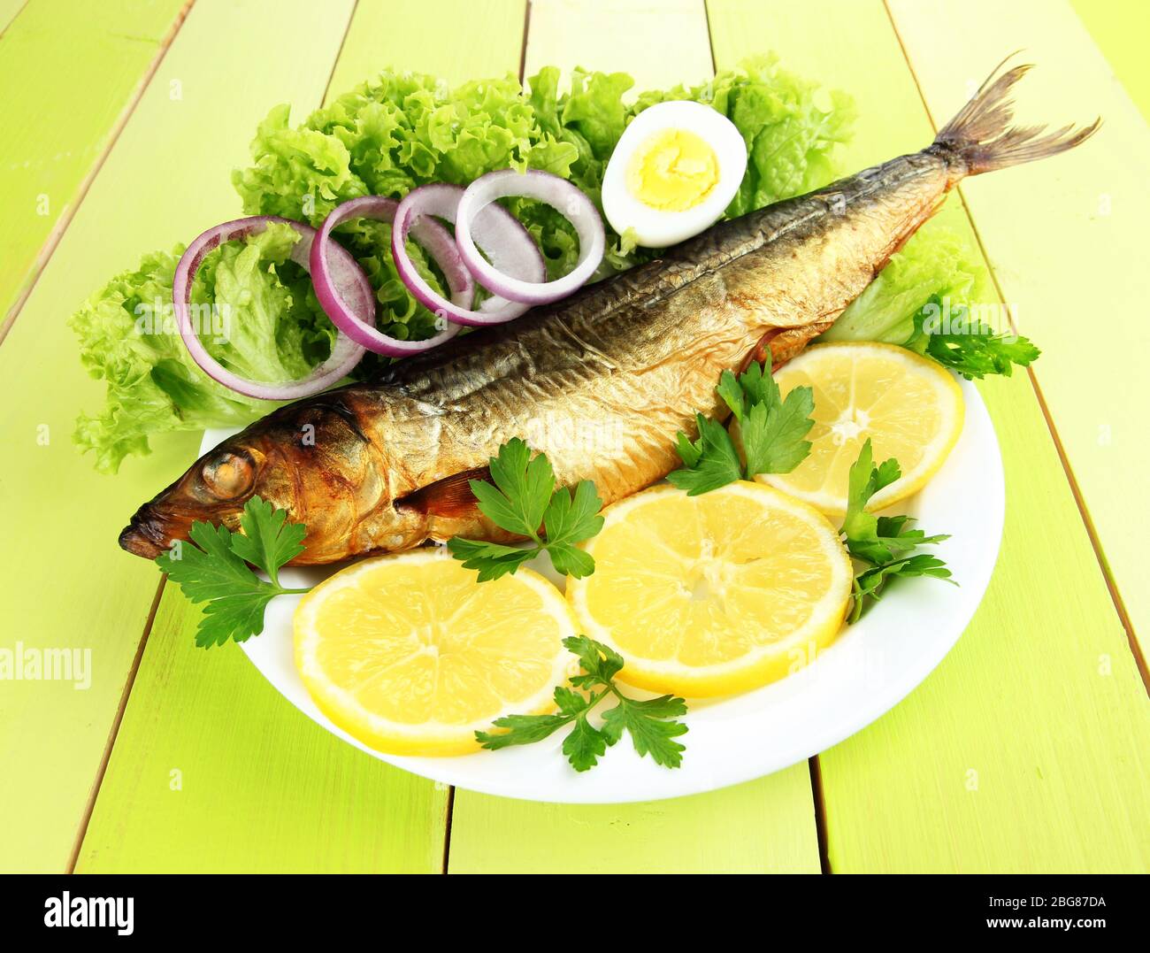 Smoked fish on plate close up Stock Photo - Alamy