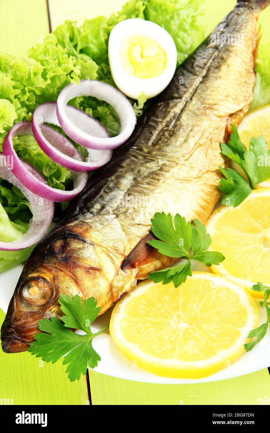 Smoked fish on plate close up Stock Photo - Alamy