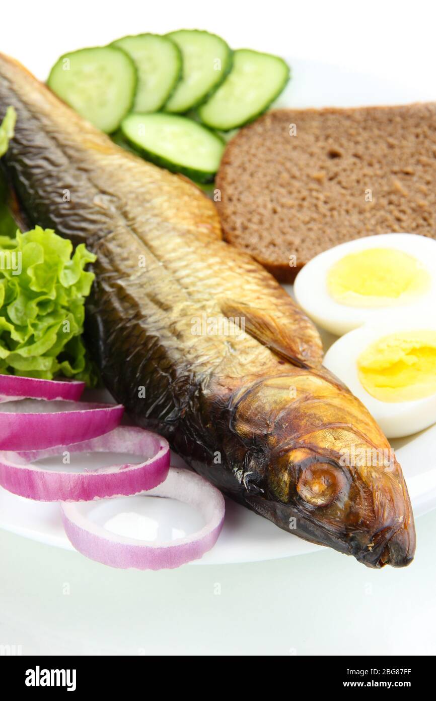 Smoked fish on plate close up Stock Photo - Alamy