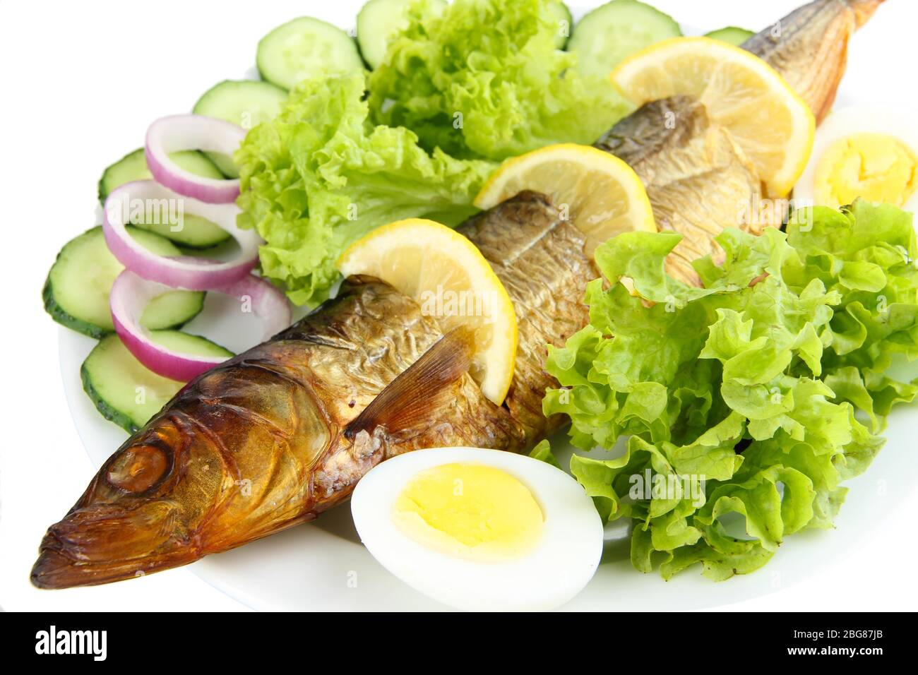 Smoked fish on plate close up Stock Photo - Alamy