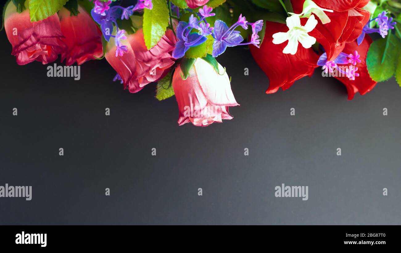 Memorial mockup with artificial flowers on a dark background Stock ...