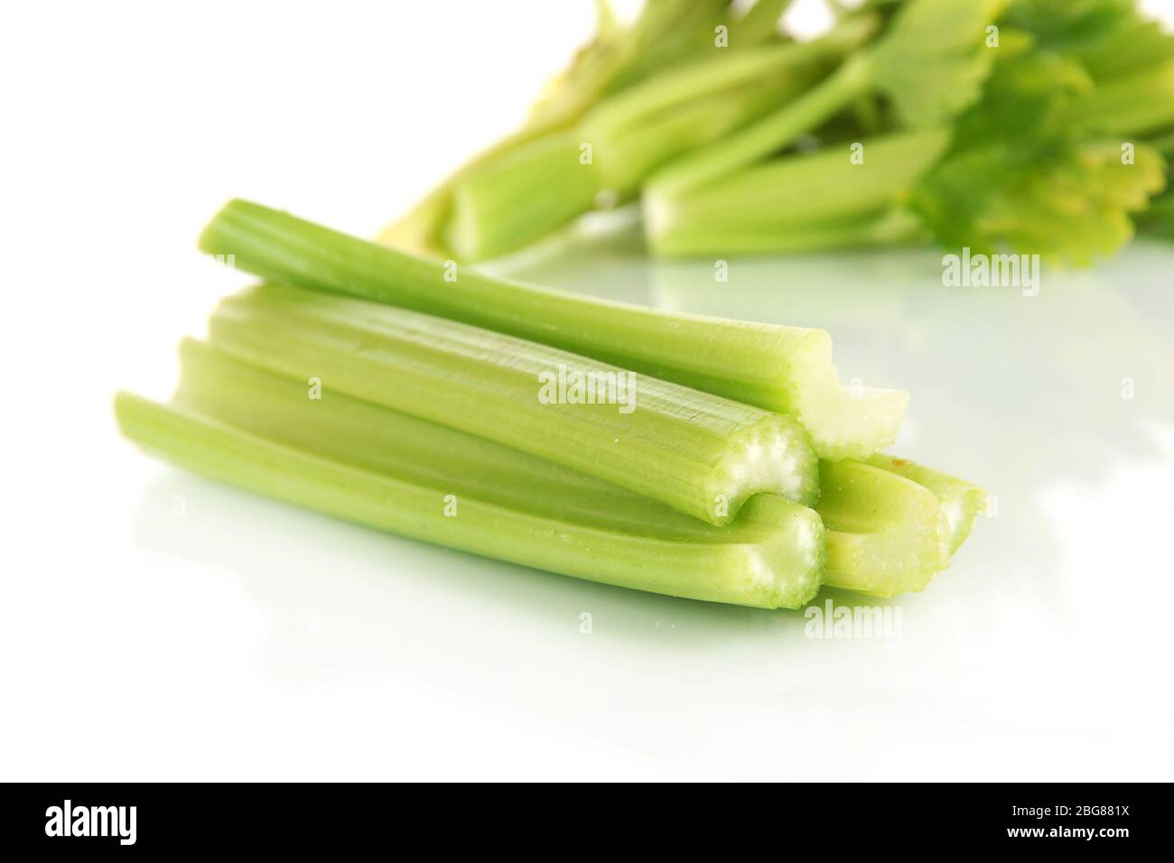 Fresh green celery isolated on white Stock Photo - Alamy