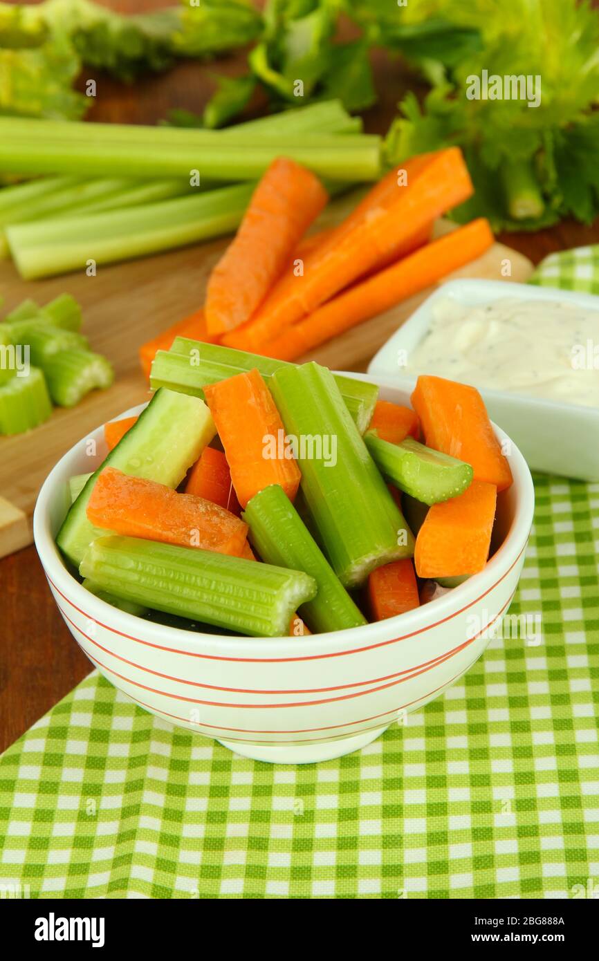 Fresh green celery with vegetables in bowl on table close-up Stock ...