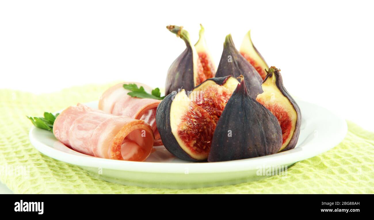 Tasty figs with ham, isolated on white Stock Photo - Alamy
