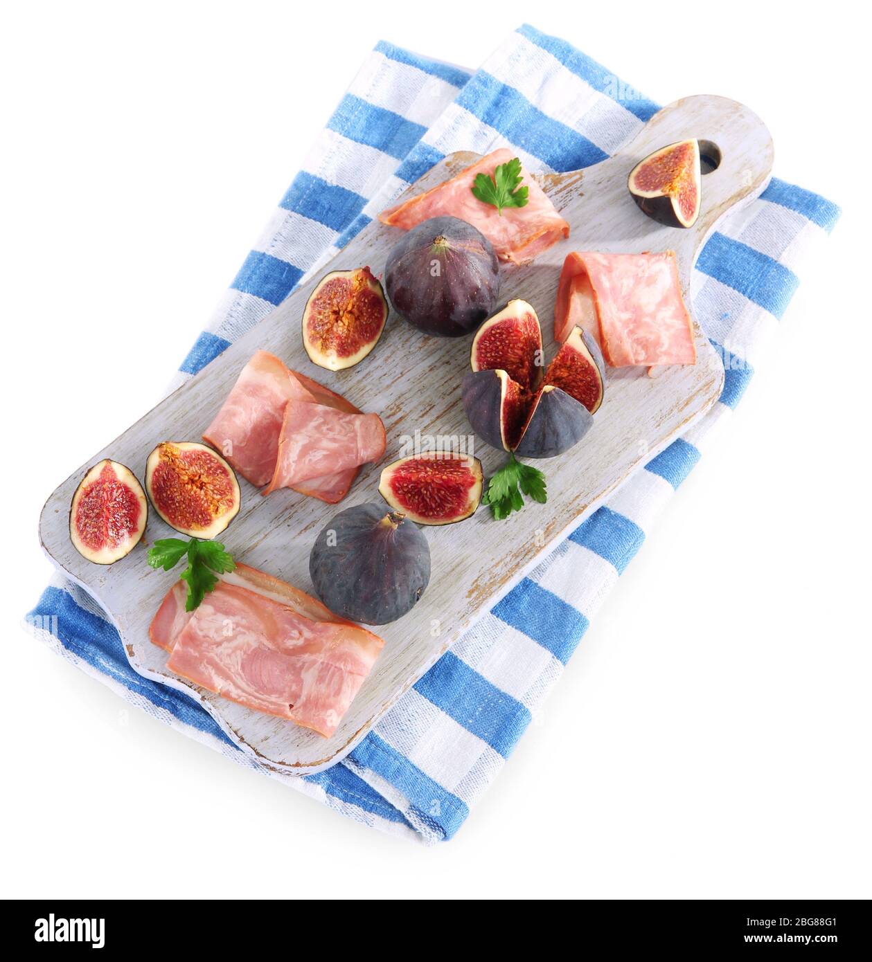 Tasty figs with ham, isolated on white Stock Photo - Alamy
