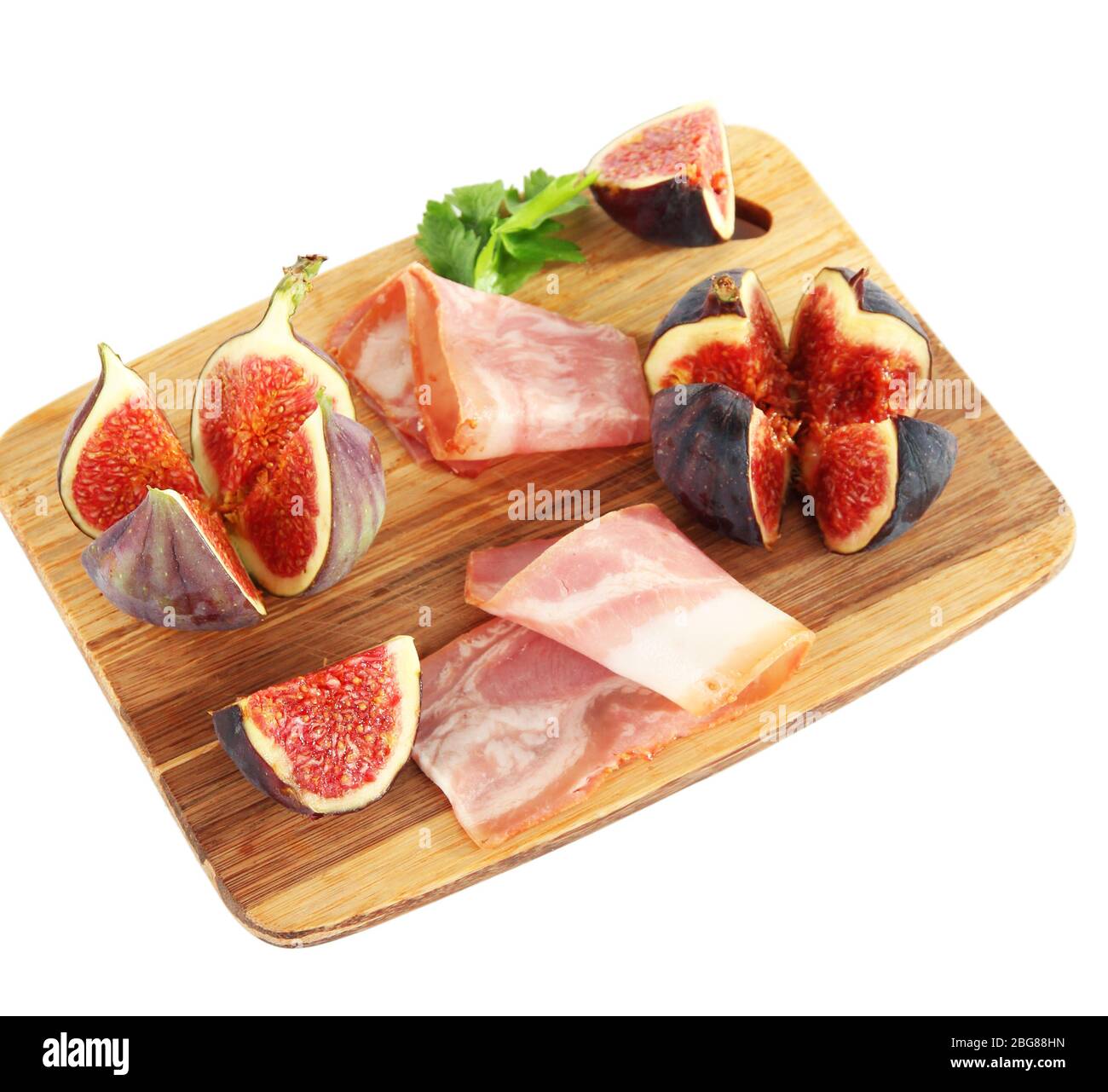 Tasty figs with ham, isolated on white Stock Photo - Alamy