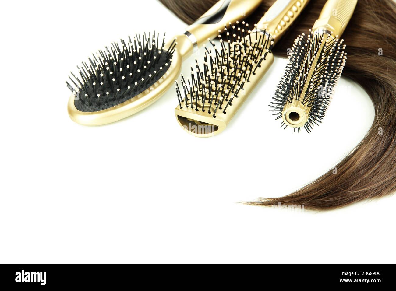 Shiny brown hair with combs isolated on white Stock Photo - Alamy