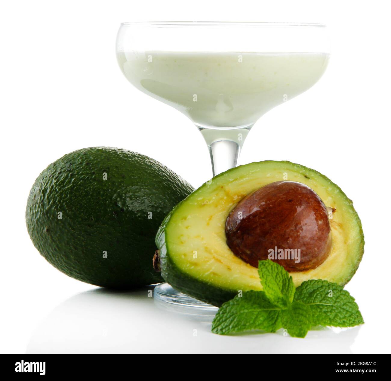 Fresh avocado smoothie isolated on white Stock Photo - Alamy