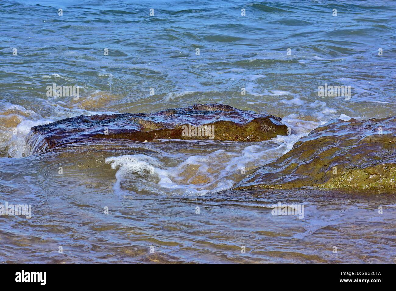 Water over rocks Stock Photo - Alamy