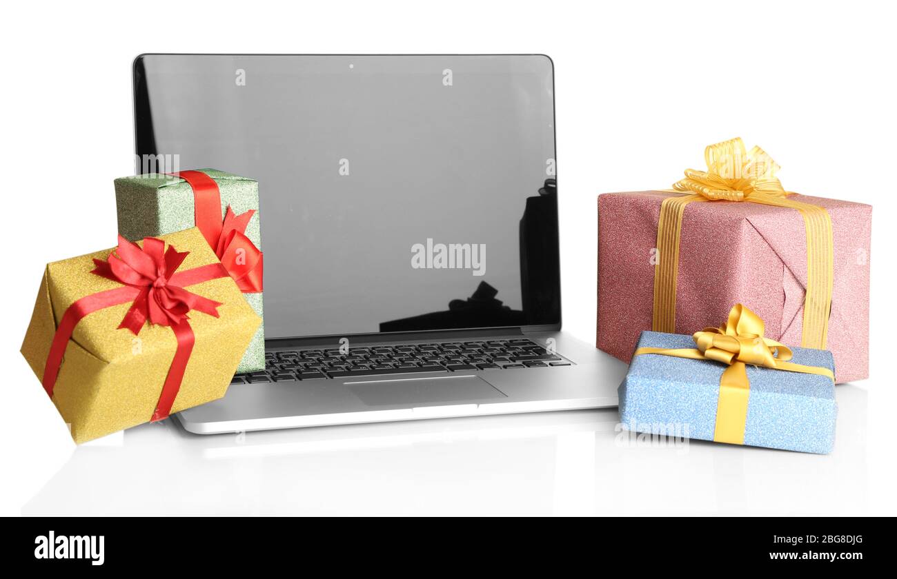 Laptop and gifts isolated on white Stock Photo - Alamy