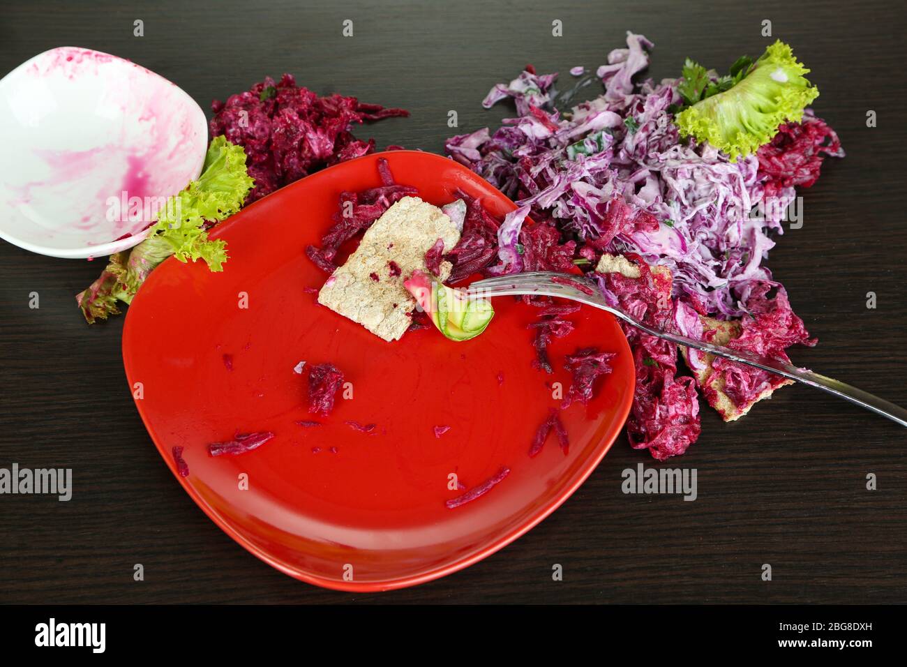 Overturned plate of food on floor Stock Photo - Alamy