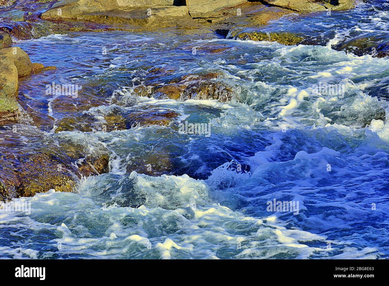 Water running over rocks Stock Photo - Alamy