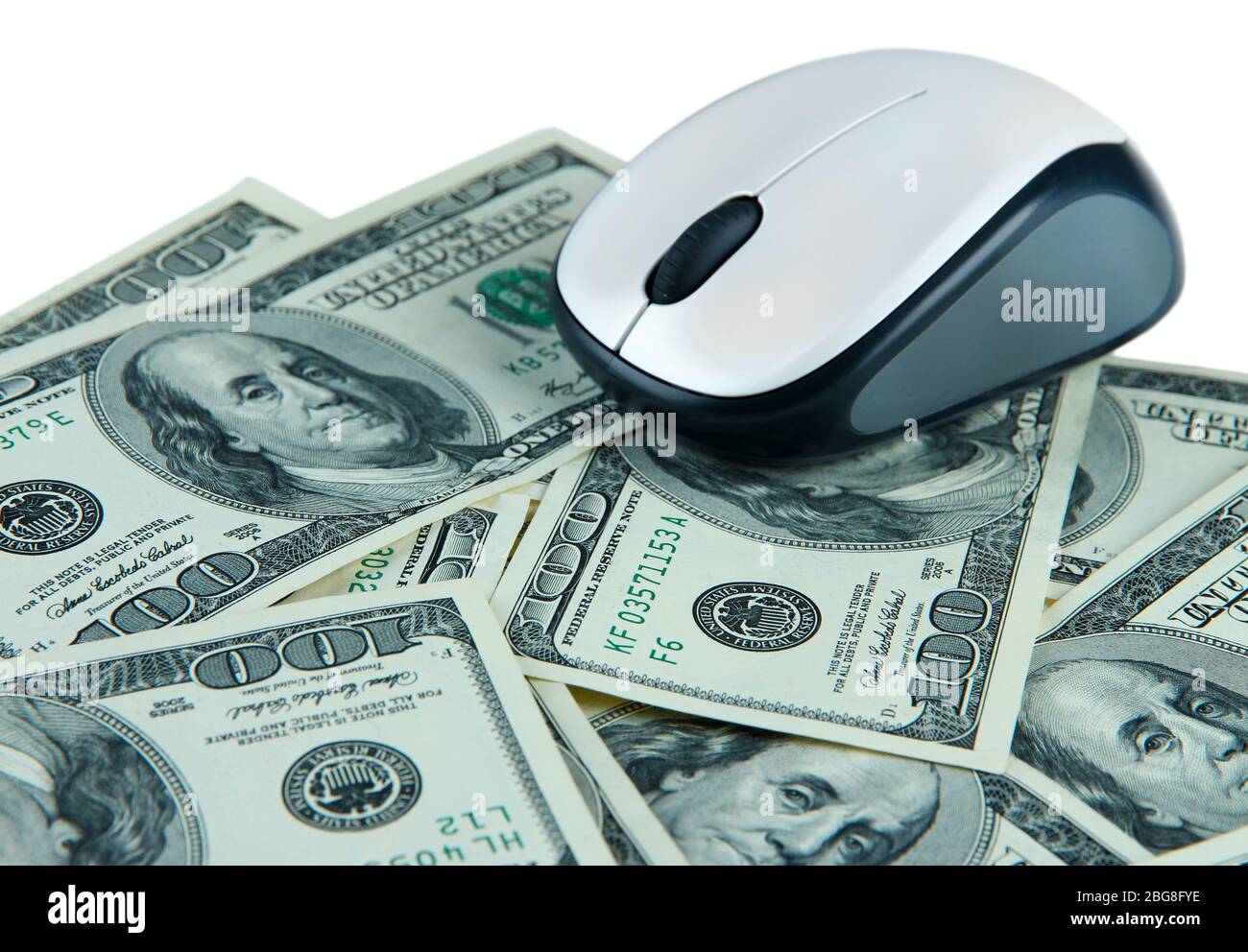 Computer mouse on dollars close up Stock Photo - Alamy