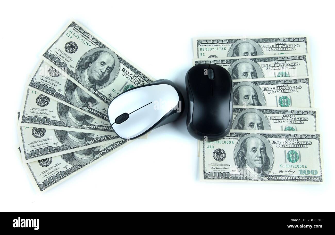 Computer mouse on dollars isolated on white Stock Photo - Alamy