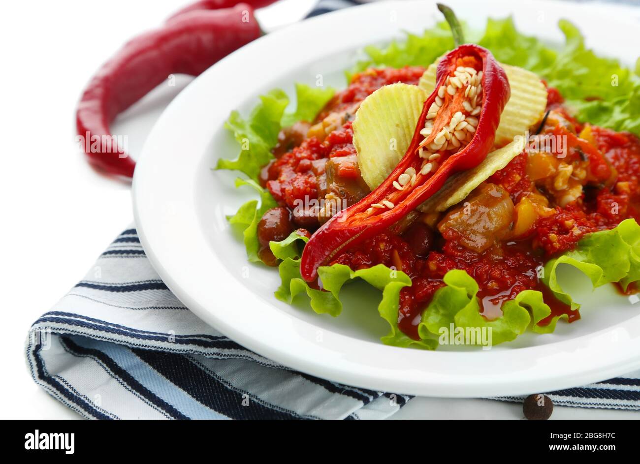 Chili Corn Carne - traditional mexican food, on white plate, on napkin ...