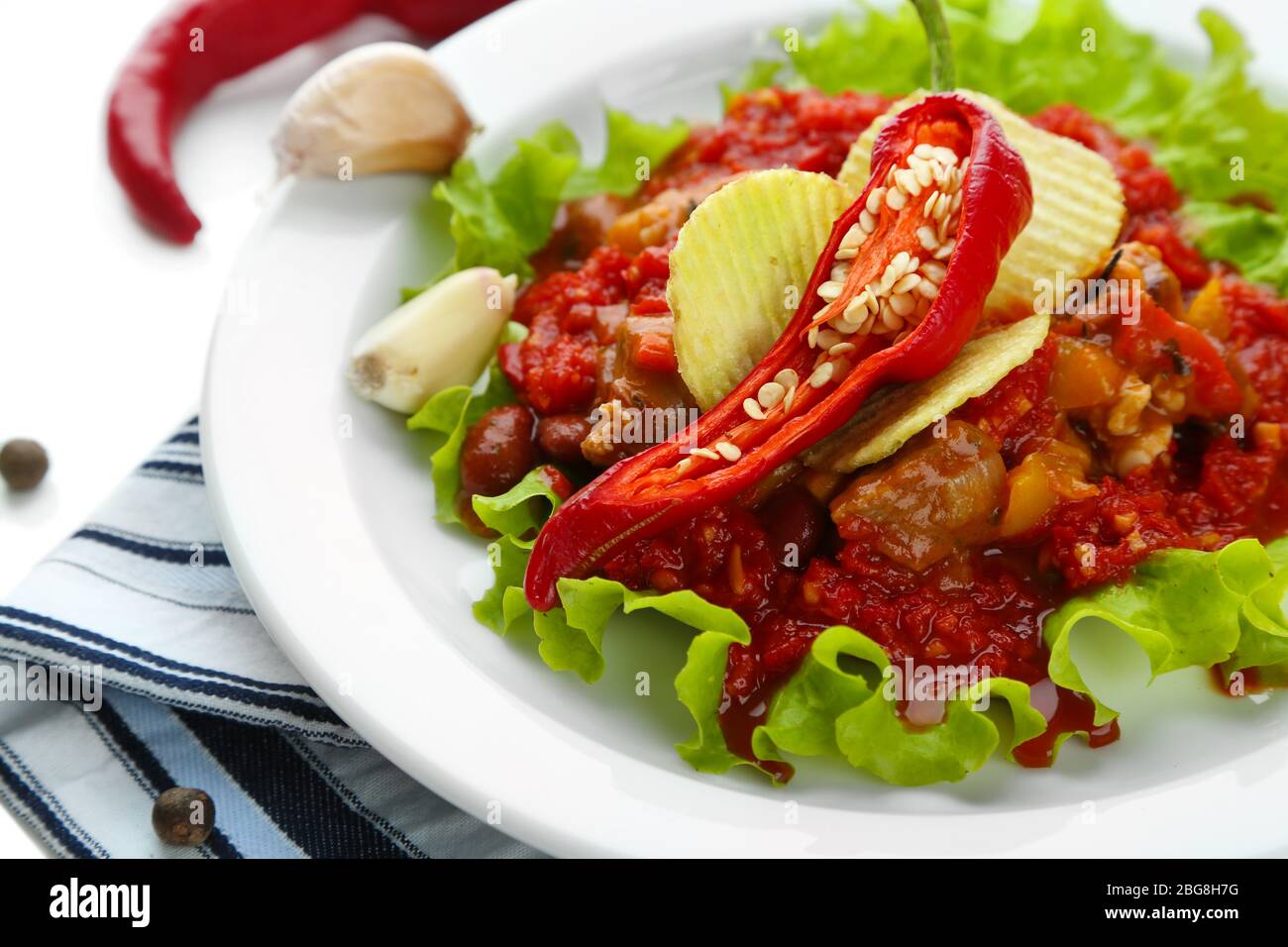 Chili Corn Carne - traditional mexican food, on white plate, on napkin ...