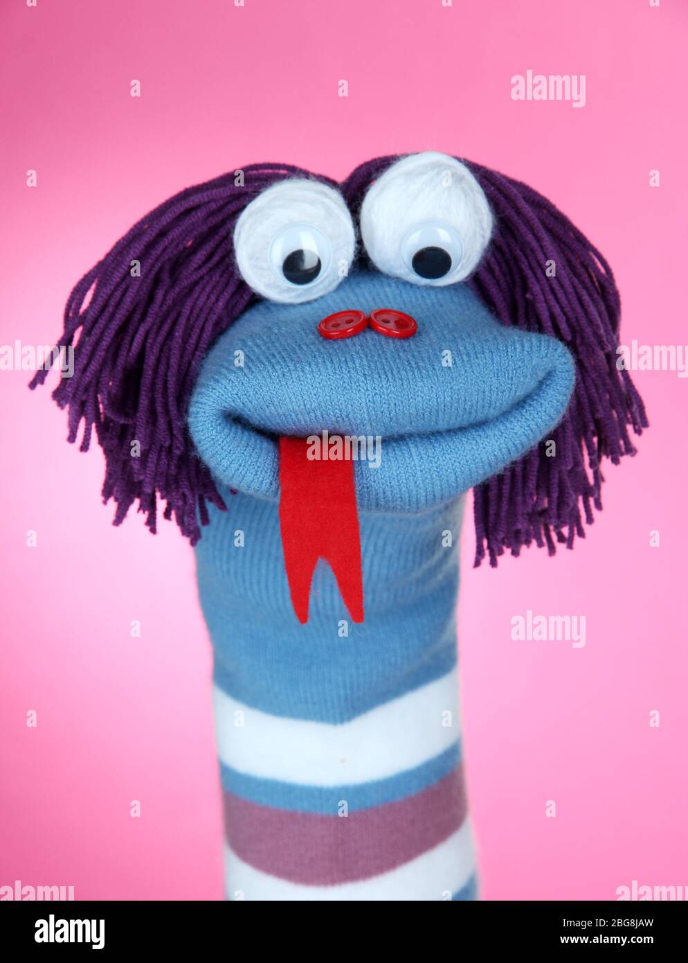 Cute sock puppet on pink background Stock Photo - Alamy