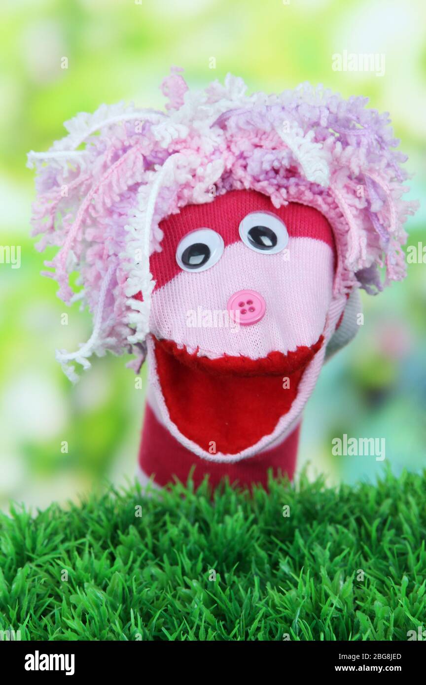 Cute sock puppet on bright background Stock Photo - Alamy