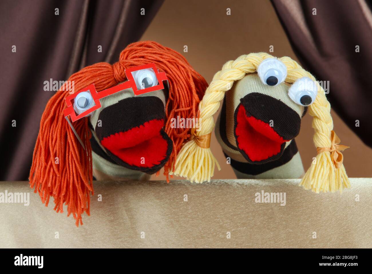 Puppet show on brown background Stock Photo - Alamy