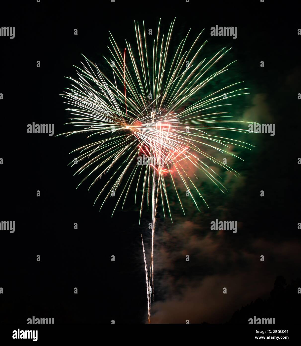 Green wave firework exploding in the air with copy space Stock Photo ...