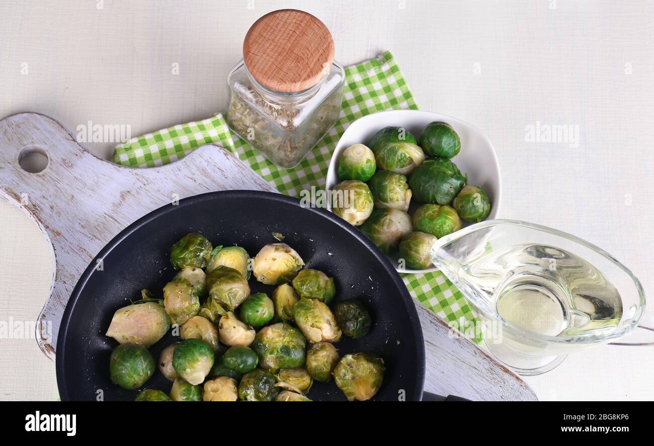 Fresh brussels sprouts in pan with vegetables and spices isolated on ...