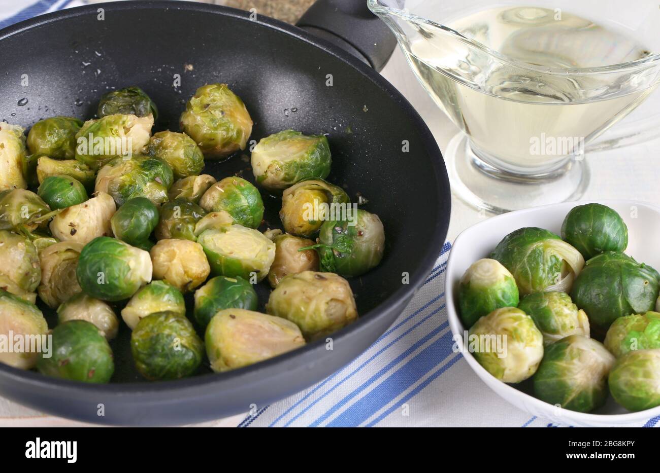 Fresh brussels sprouts in pan with vegetables and spices isolated on ...