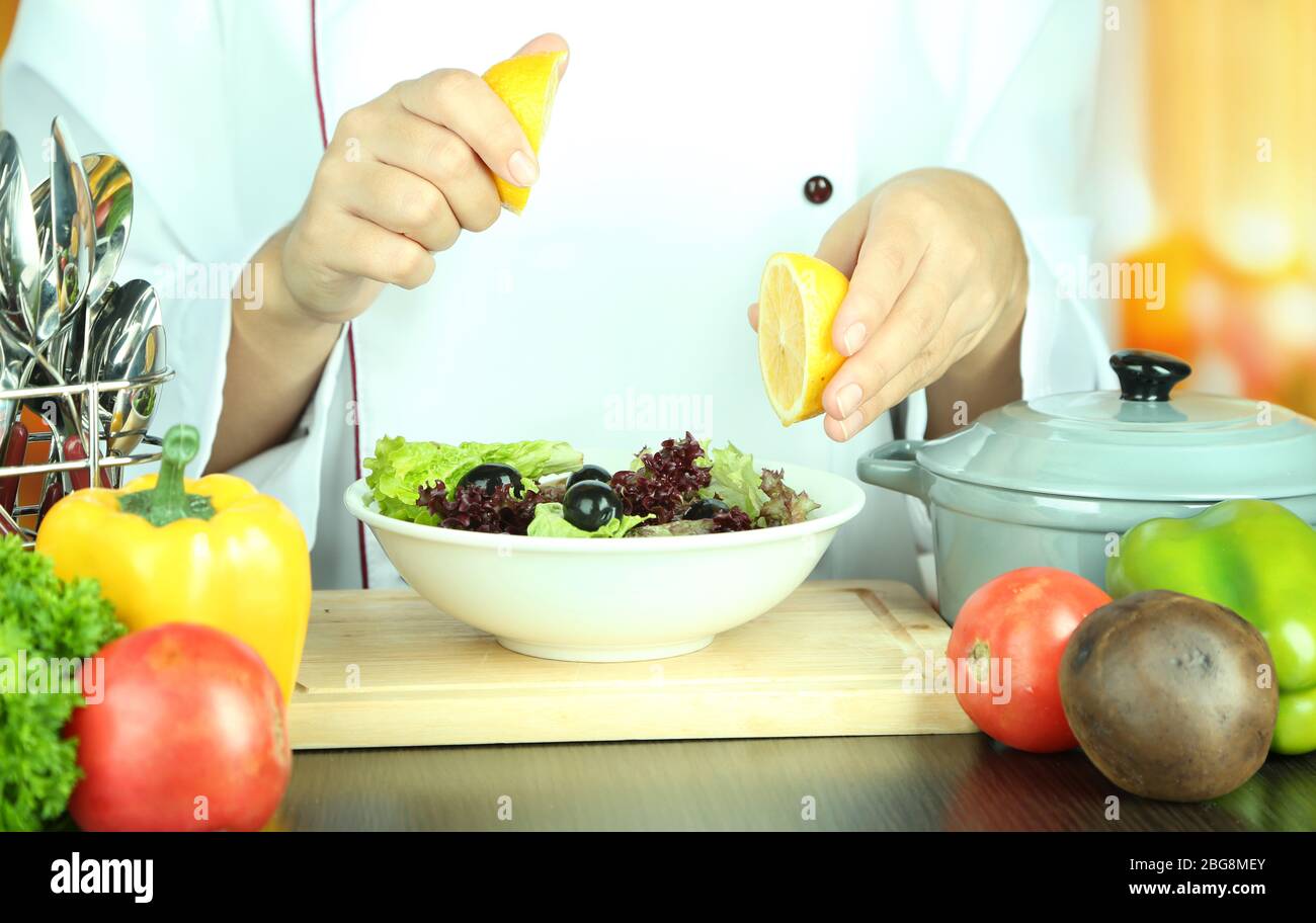 Cook hands prepare salad Stock Photo - Alamy
