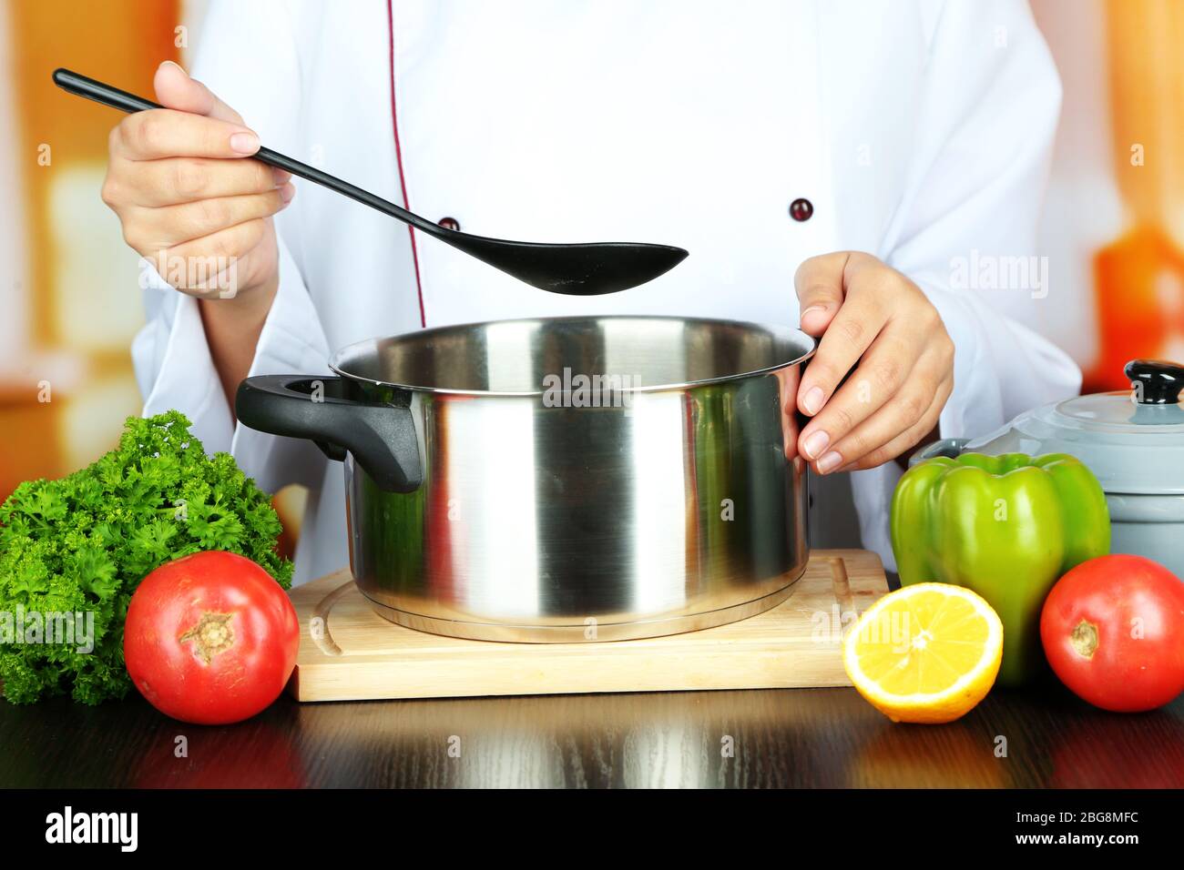 Cook hands and pan at workplace Stock Photo - Alamy