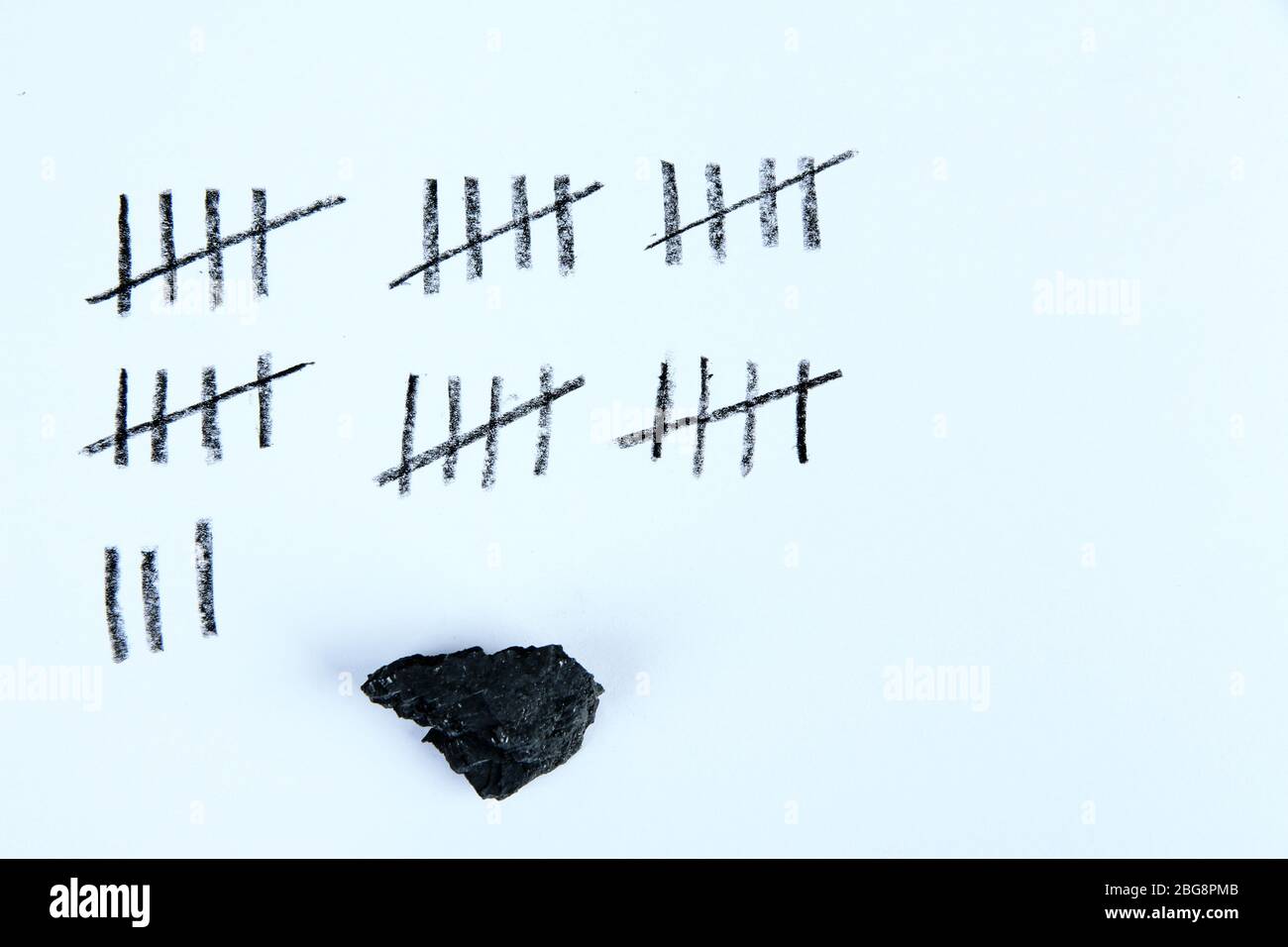 Counting days by drawing sticks isolated on white Stock Photo - Alamy