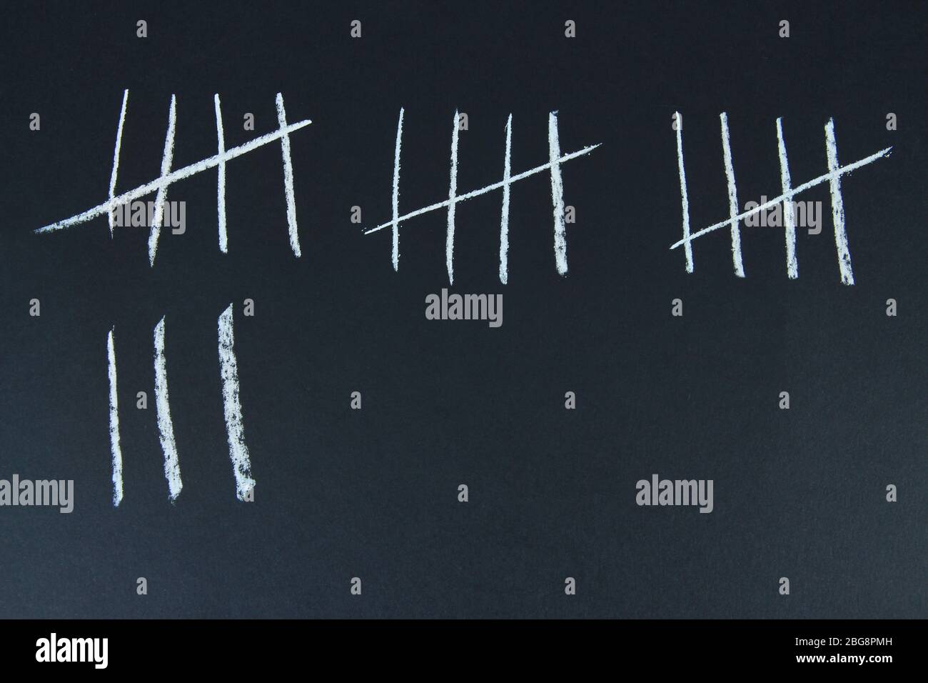 Counting days by drawing sticks isolated on black Stock Photo - Alamy