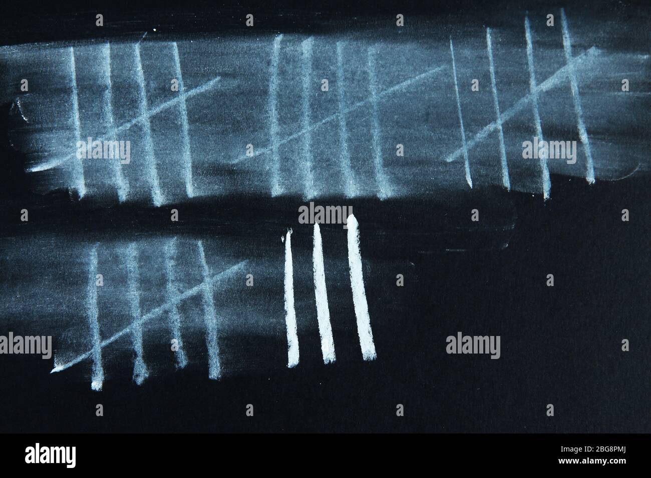 Counting days by drawing sticks isolated on black Stock Photo - Alamy