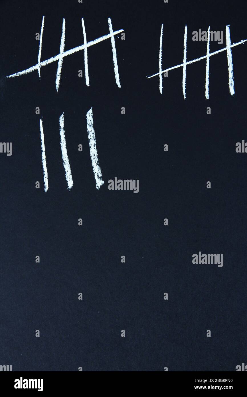 Counting days by drawing sticks isolated on black Stock Photo - Alamy