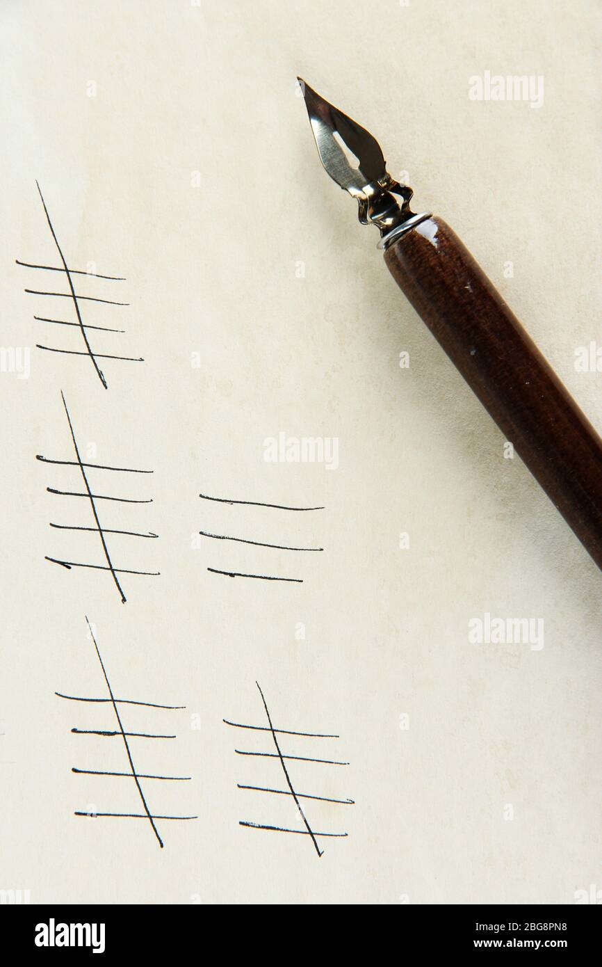 Counting days by drawing sticks on paper close up Stock Photo - Alamy