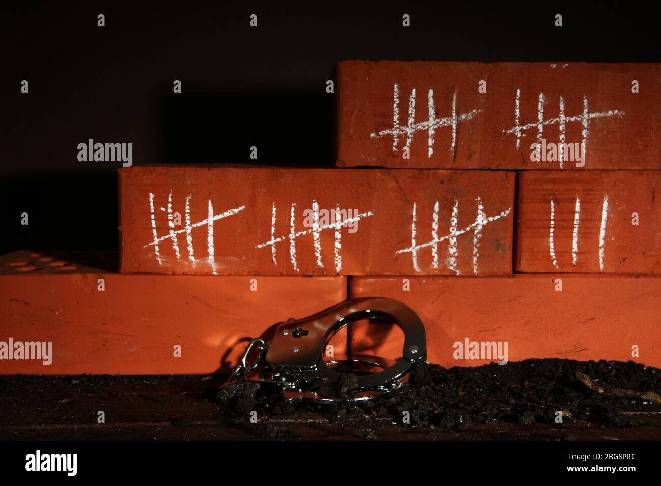 Counting days by drawing sticks on bricks on dark background Stock ...