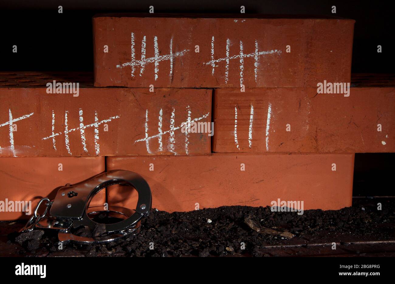 Counting days by drawing sticks on bricks on dark background Stock ...