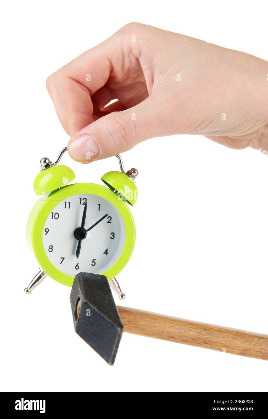 Hammer and alarm clock in hand isolated on white Stock Photo - Alamy