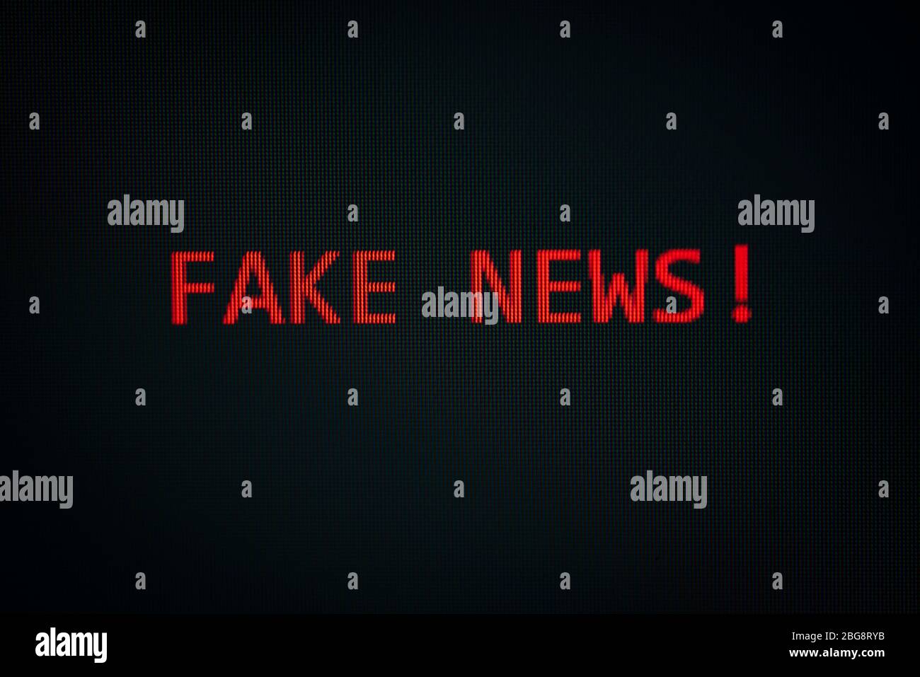 FAKE NEWS message on display screen black background technology alert ...