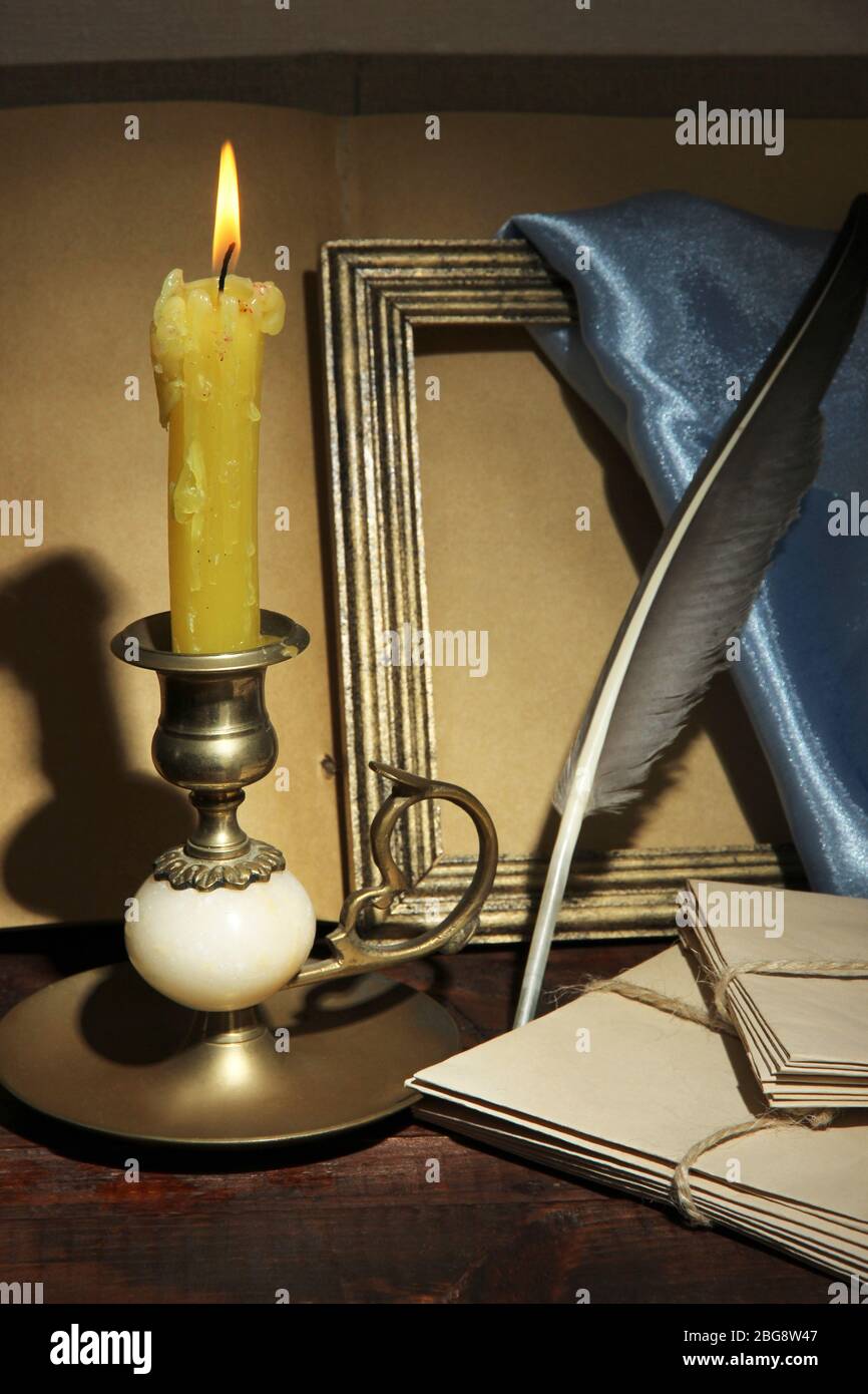 Old candle on table in room Stock Photo - Alamy
