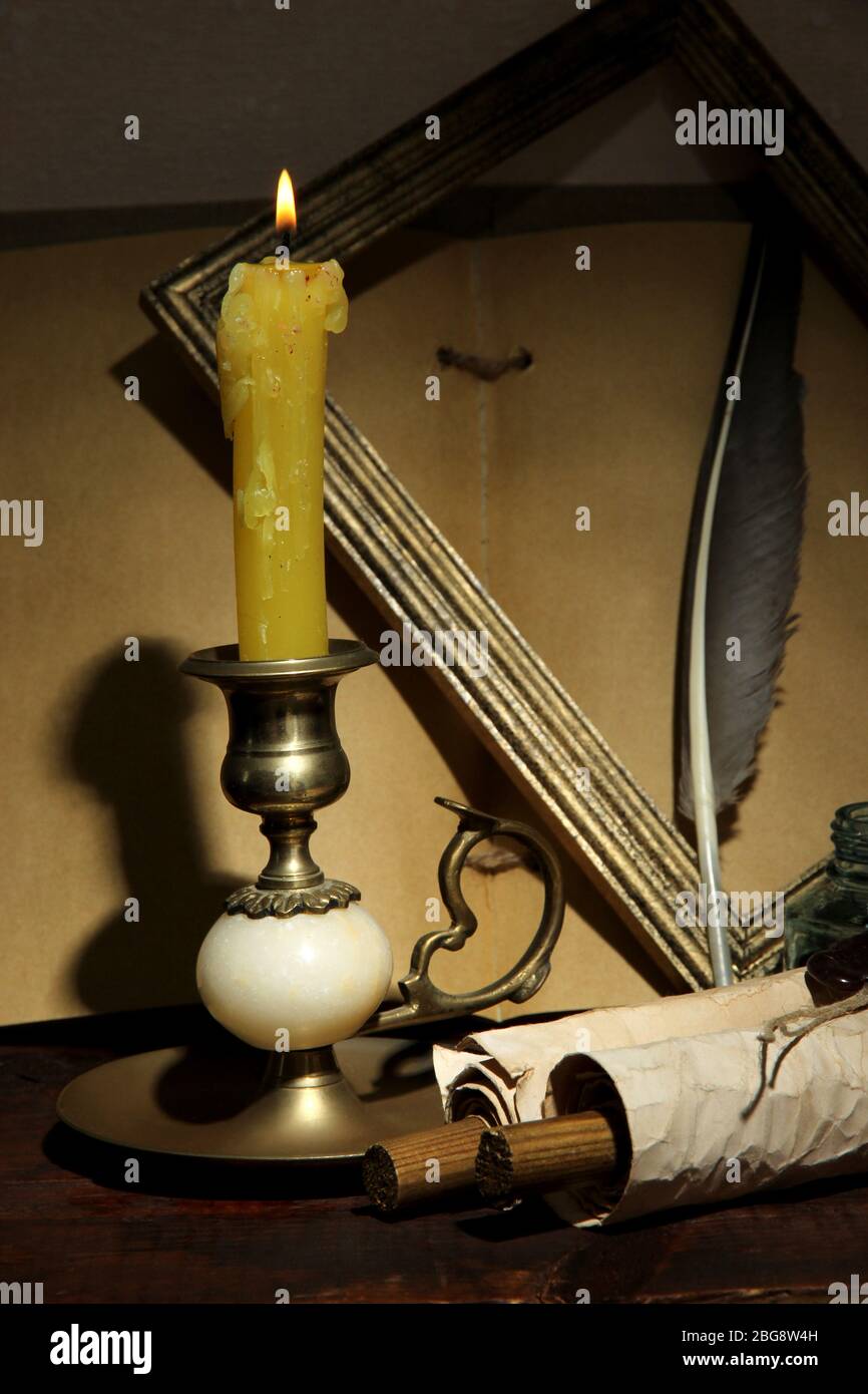 Old candle on table in room Stock Photo - Alamy