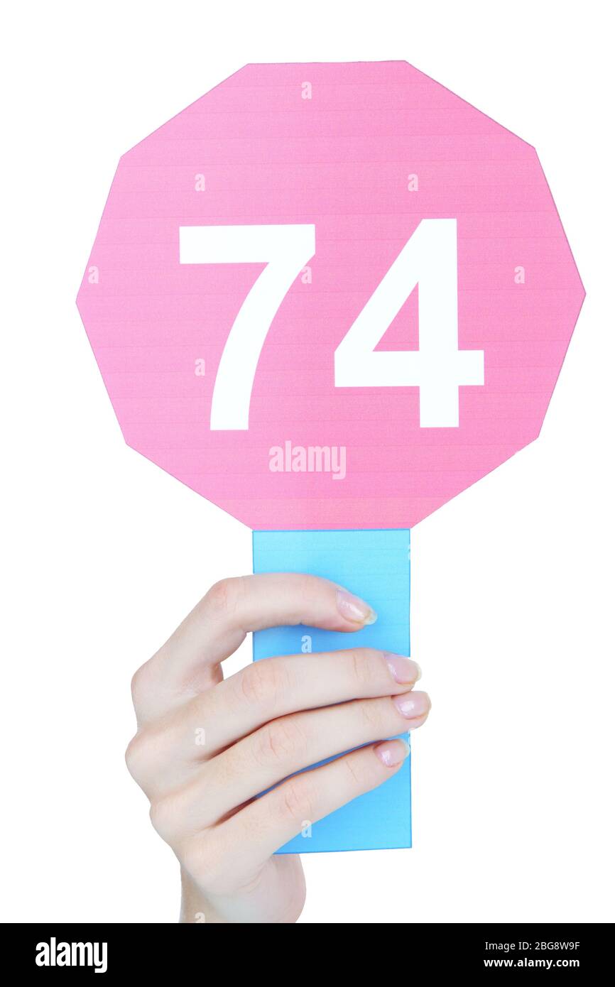 Hand holding auction paddle isolated on white Stock Photo - Alamy