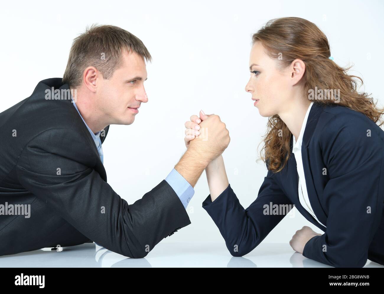 Business people wrestling isolated on white Stock Photo - Alamy