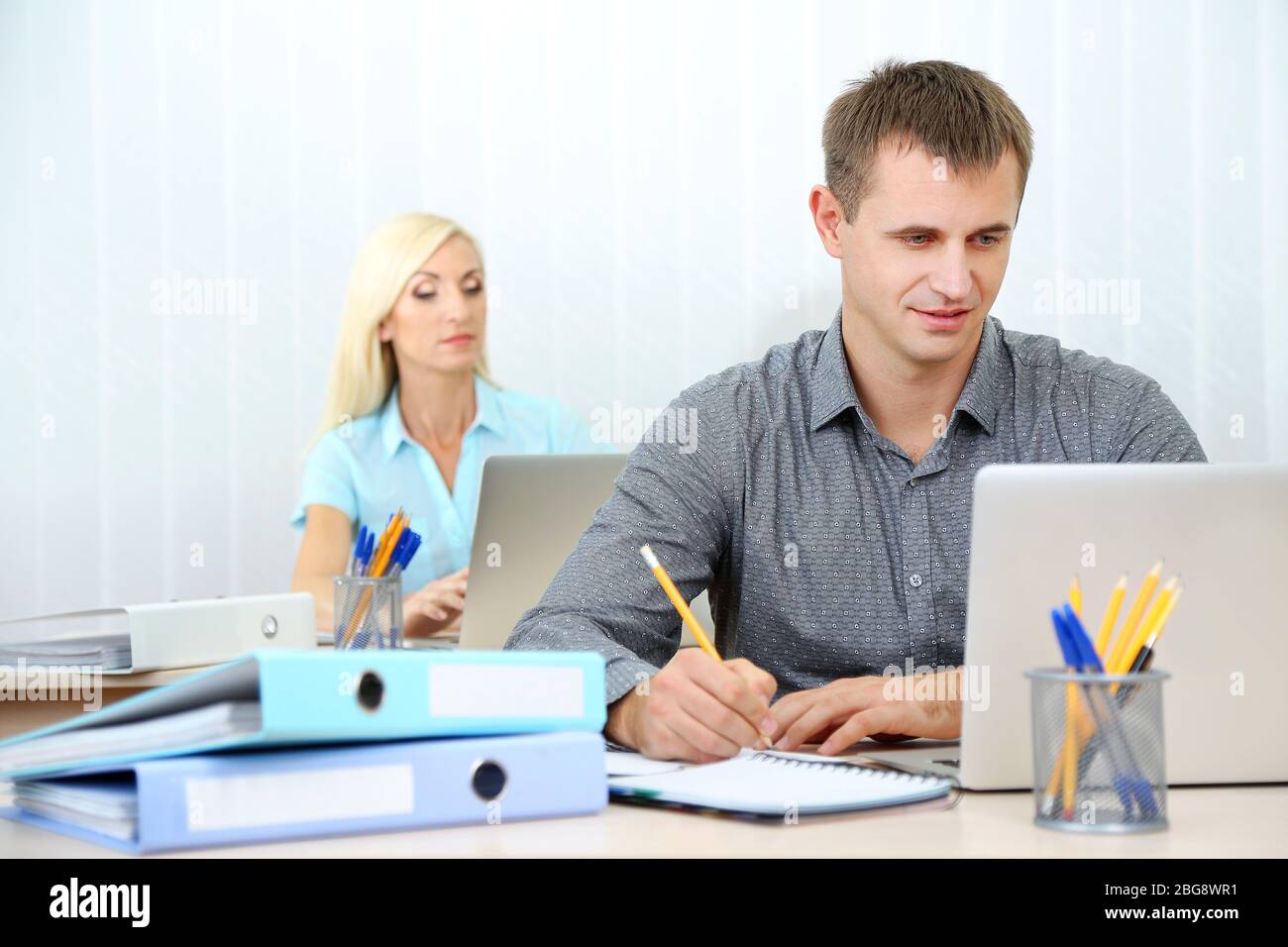 Office staff is during work in workplace Stock Photo - Alamy